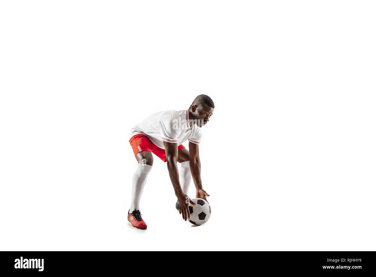 Professional african american football soccer player in motion isolated ...