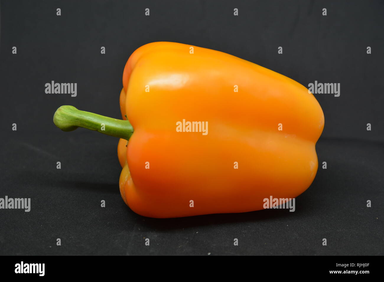 pepperone Yellow vegetable food paprika on black background Stock Photo ...