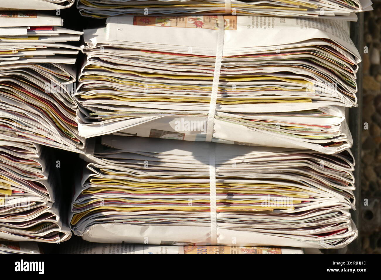 Newspaper pile of daily newspapers, background, texture Stock Photo - Alamy