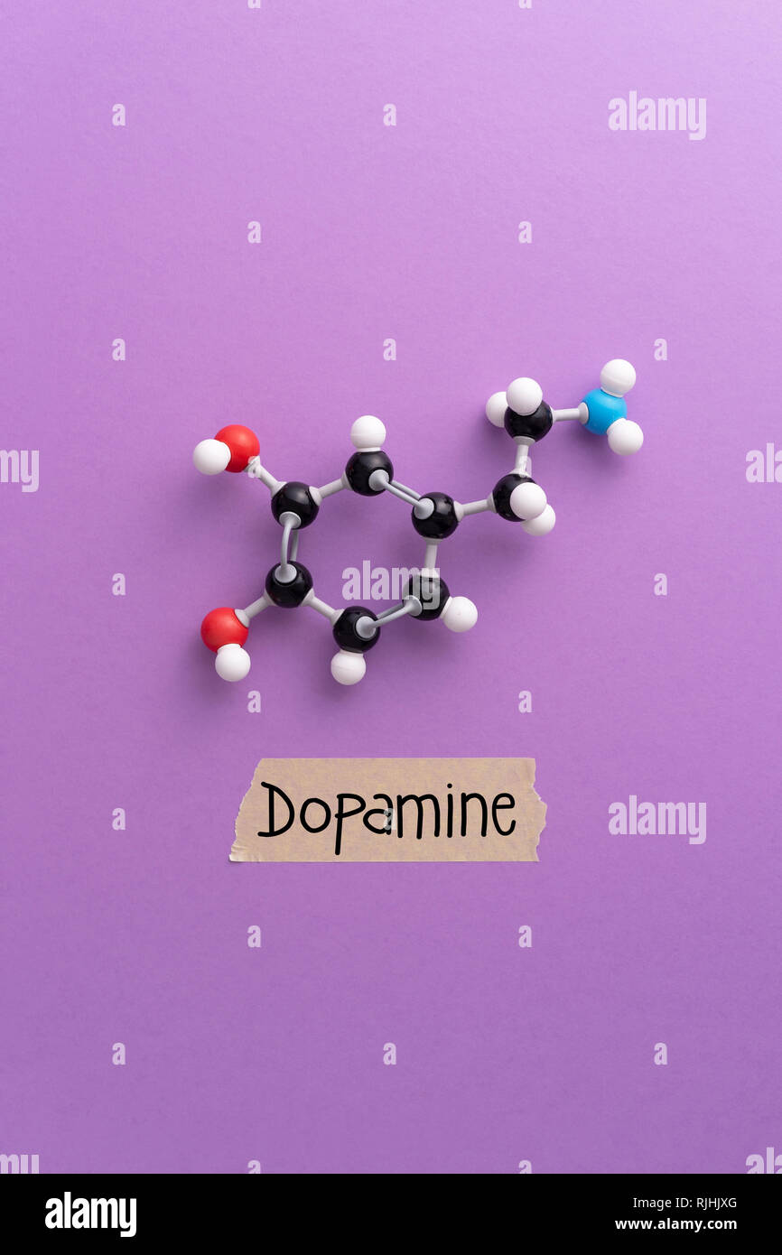 Dopamine chemical formula with "dopamine" handwrite text over purple ...
