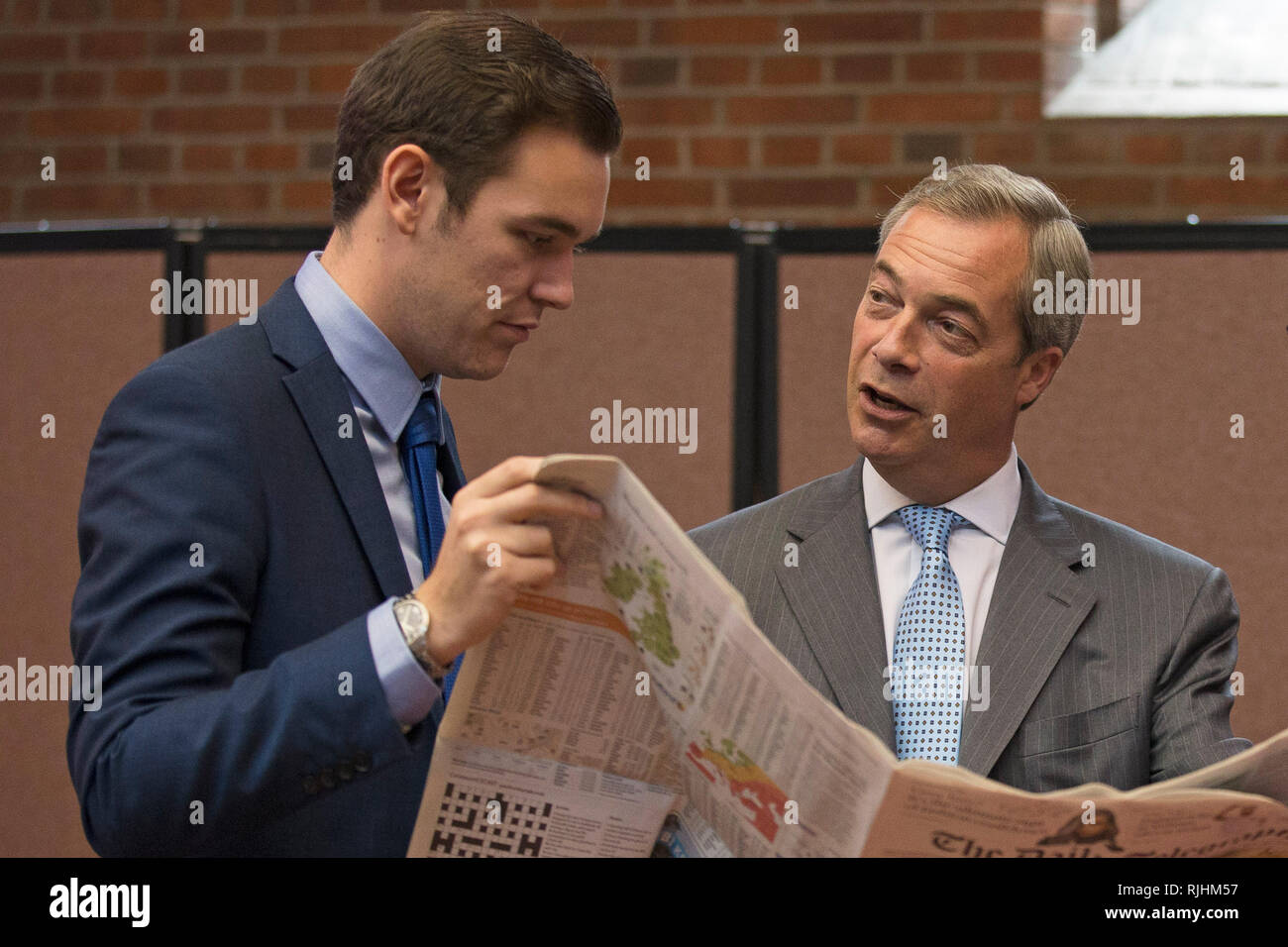 Michael Heaver and Nigel Farage look at a newspaper together before a ...