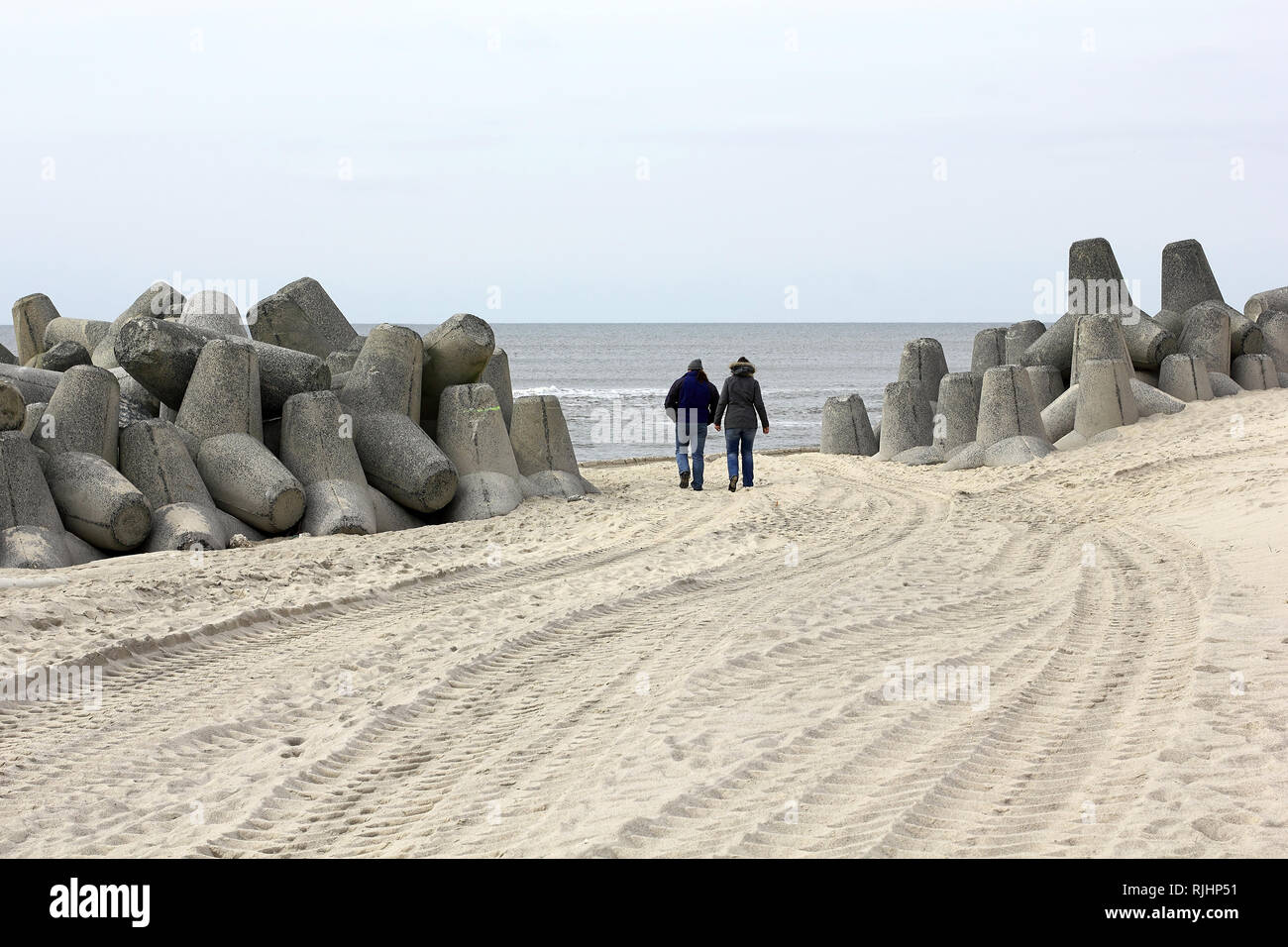 A walk through the tetrapod barrier at the beach of Sylt Stock Photo ...