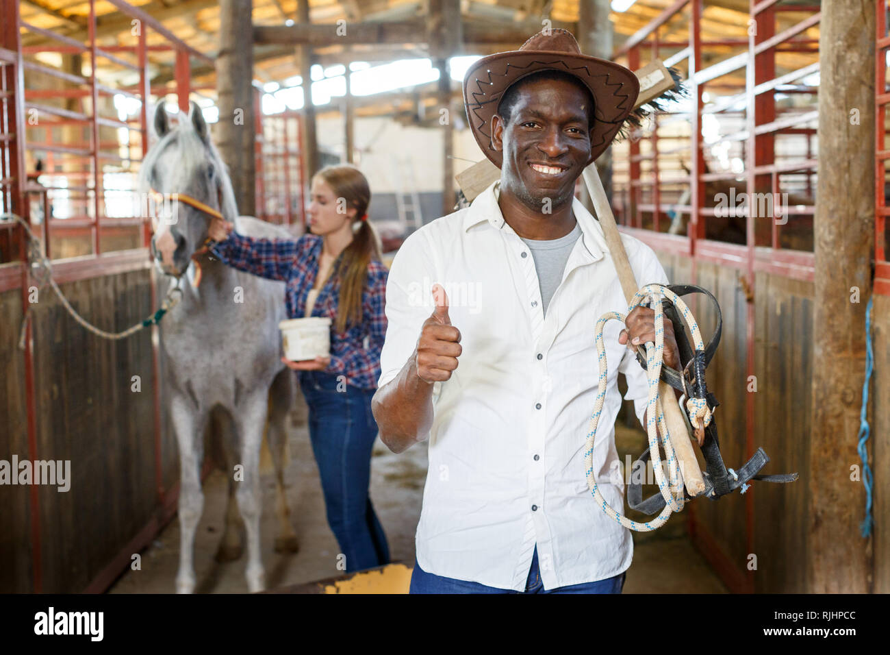 Couple working in stable hi-res stock photography and images - Alamy