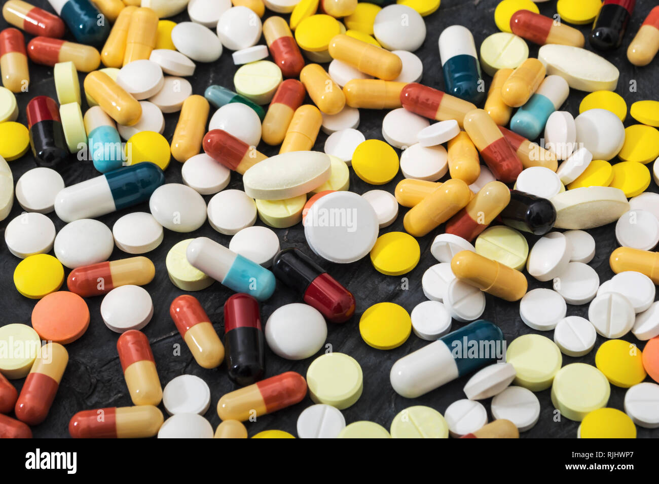 Pharmaceutical medicine pills, tablets and capsules different colors ...