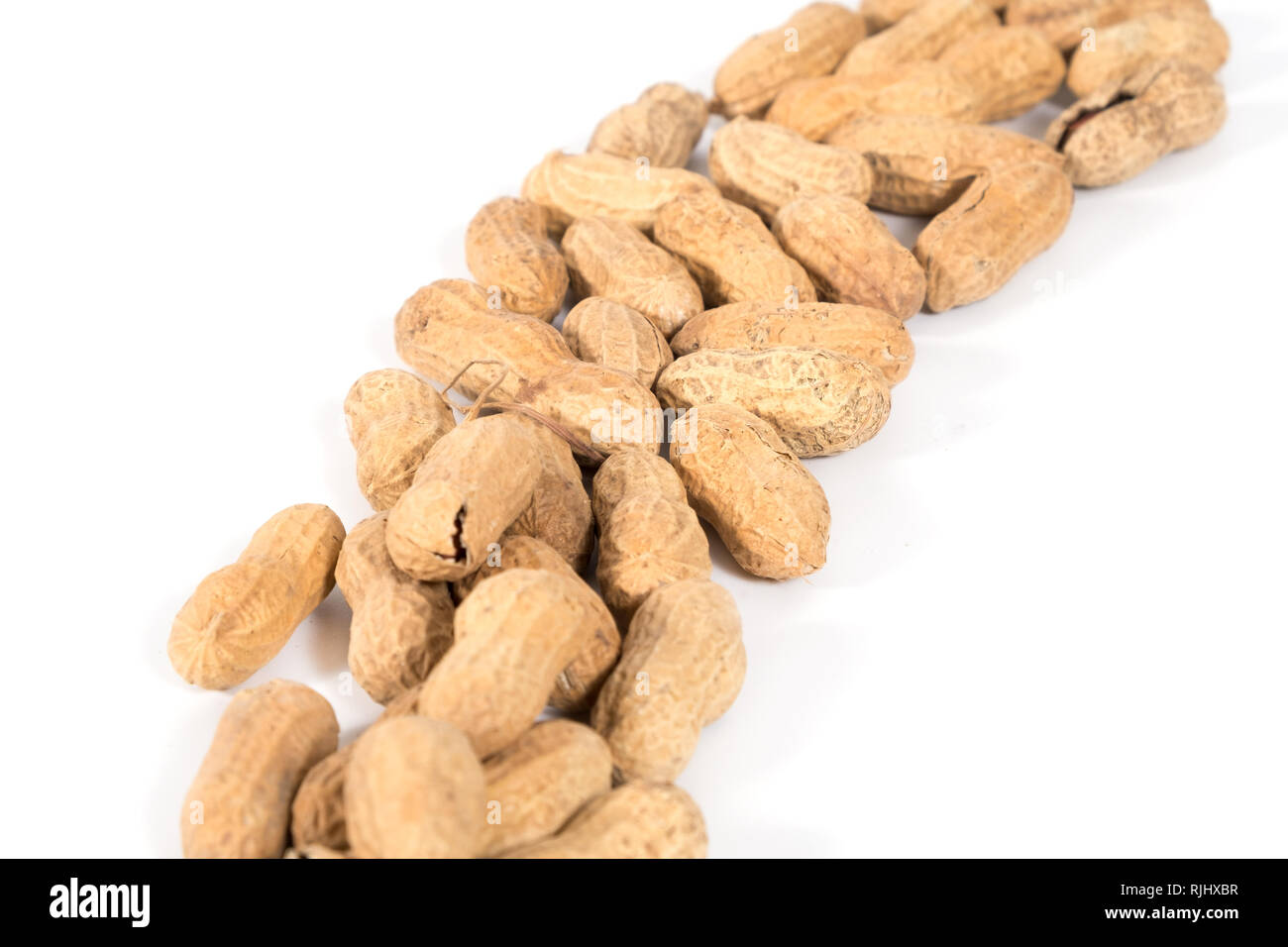 Raw tasty peanuts on white background Stock Photo - Alamy