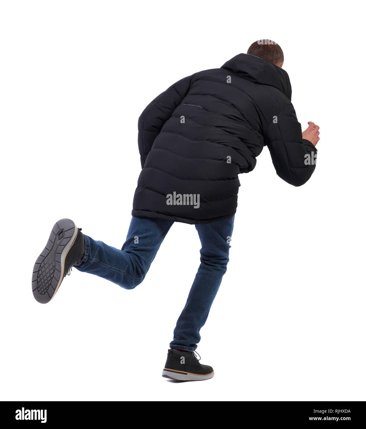 Back view of a running man in winter jacket. backside view of person ...