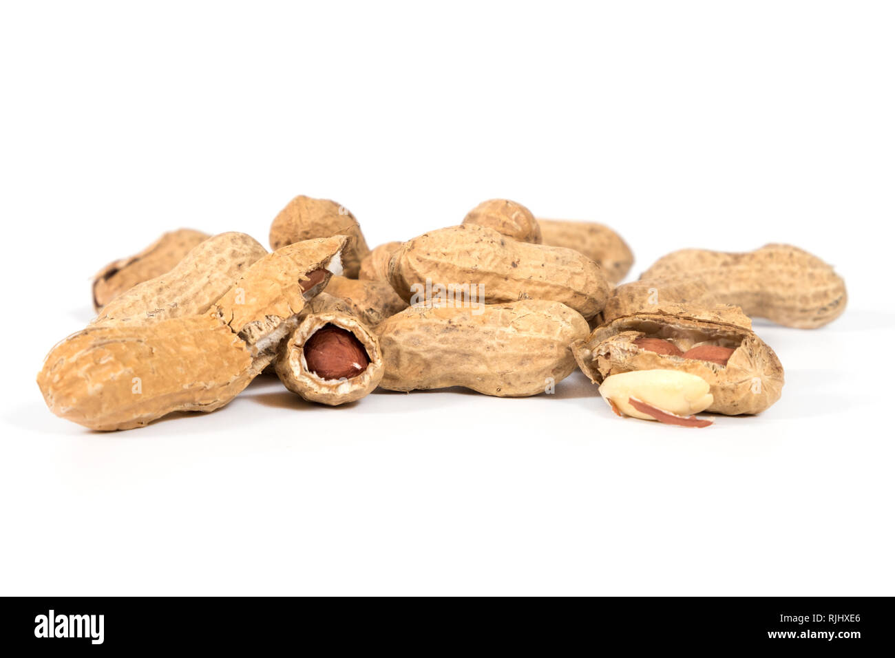 Raw tasty peanuts on white background Stock Photo - Alamy
