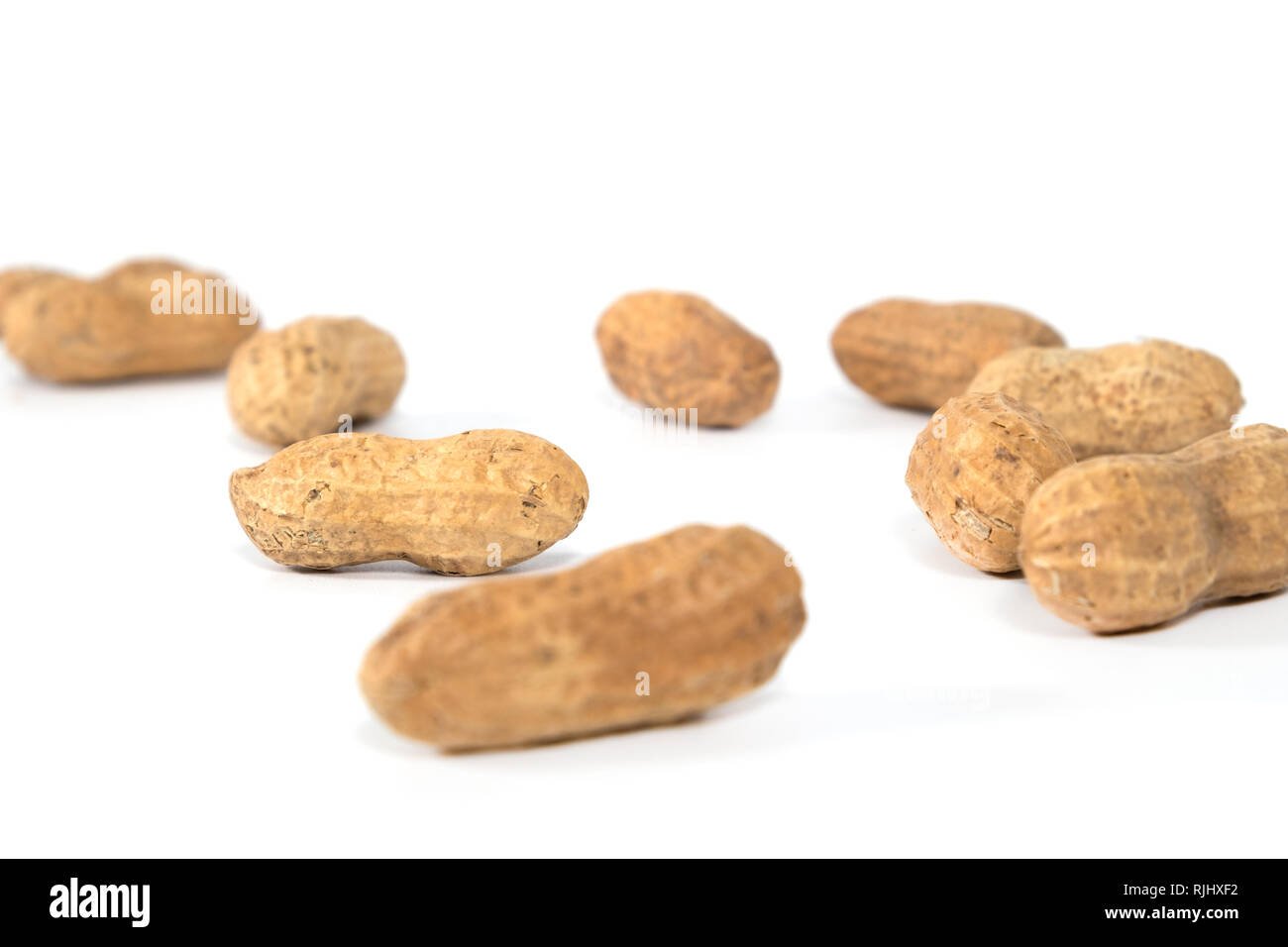 Raw tasty peanuts on white background Stock Photo - Alamy
