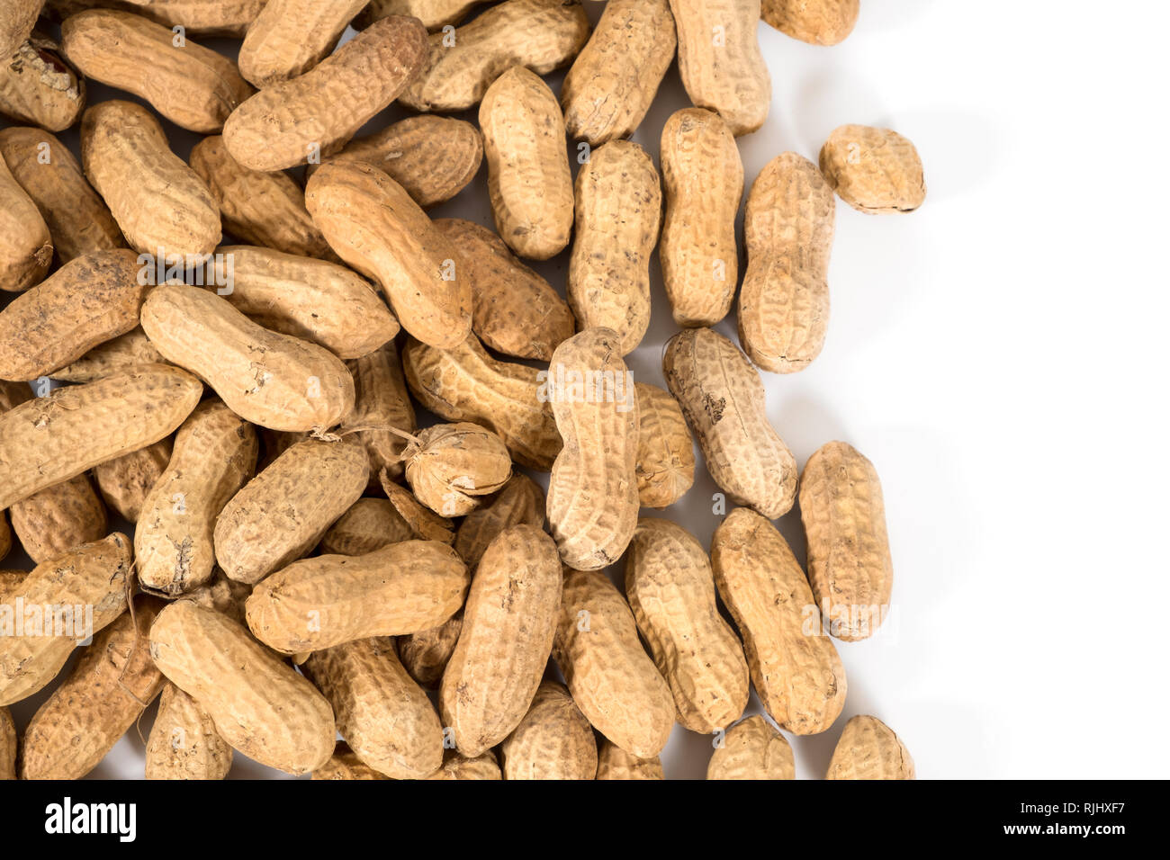 Raw tasty peanuts on white background Stock Photo - Alamy
