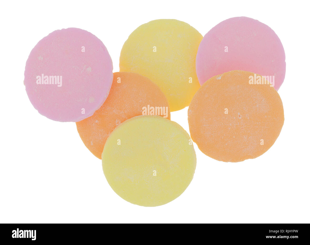 Top view of several thin colorful candy wafers isolated on a white ...