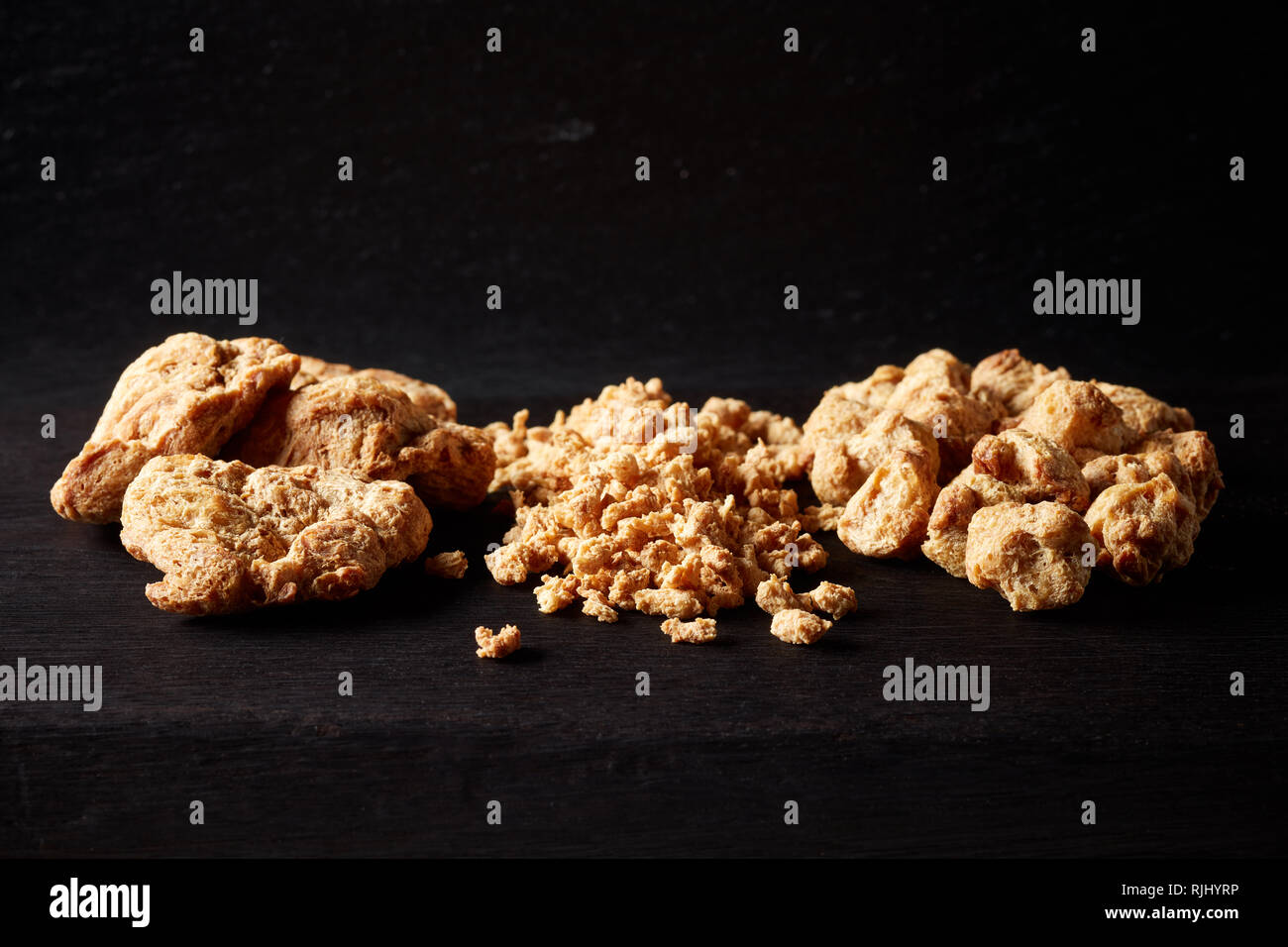 Different types of soya chunks on black background Stock Photo - Alamy