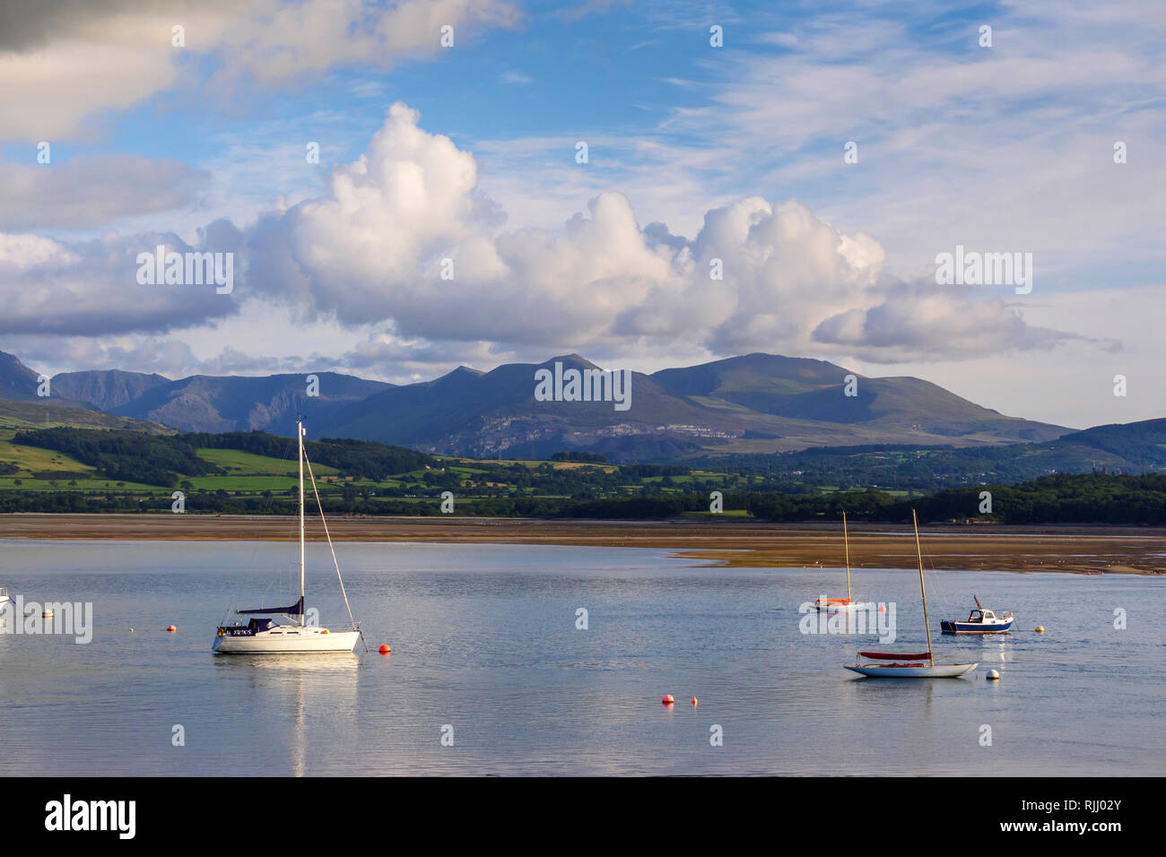 Boats moored on the Menai Strait Beaumaris Anglesey Gwynedd Wales Stock ...