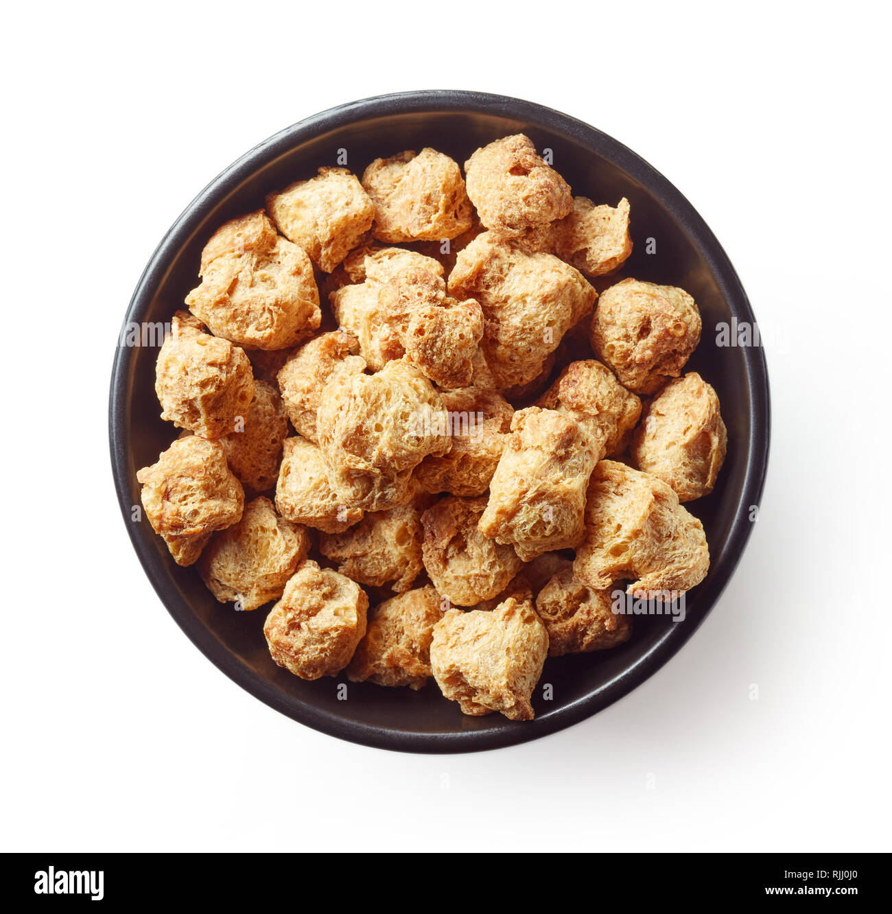 Bowl of soya chunks isolated on white background, top view Stock Photo ...