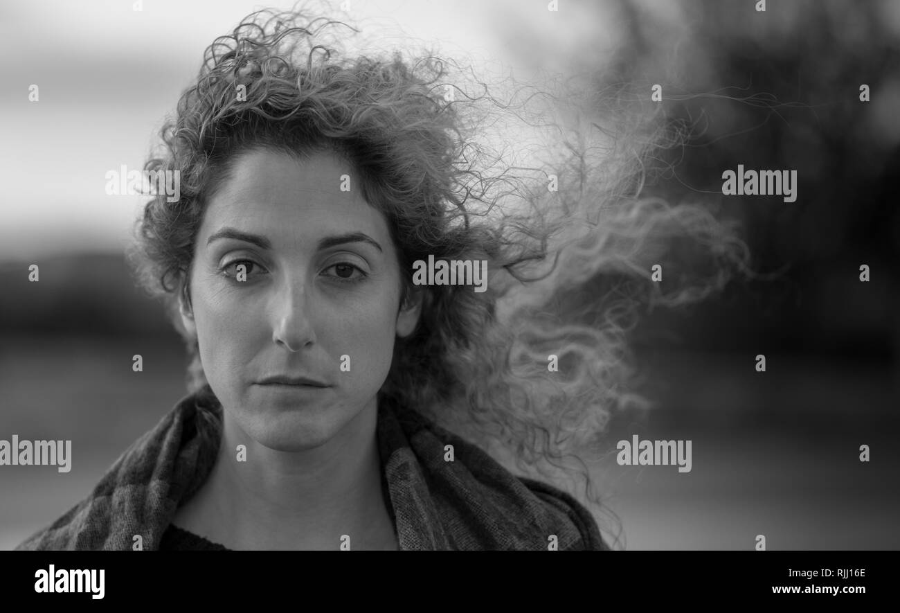 Curly windswept hair Black and White Stock Photos & Images - Alamy