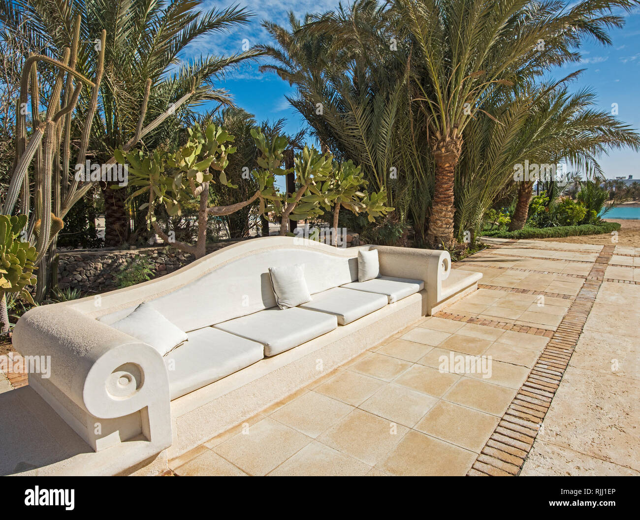 Luxury villa show home in tropical summer holiday resort with patio ...