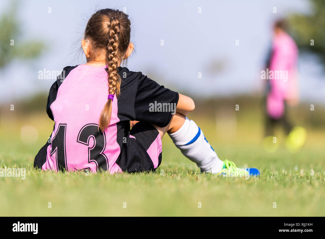 Young girl on the football match field Stock Photo - Alamy