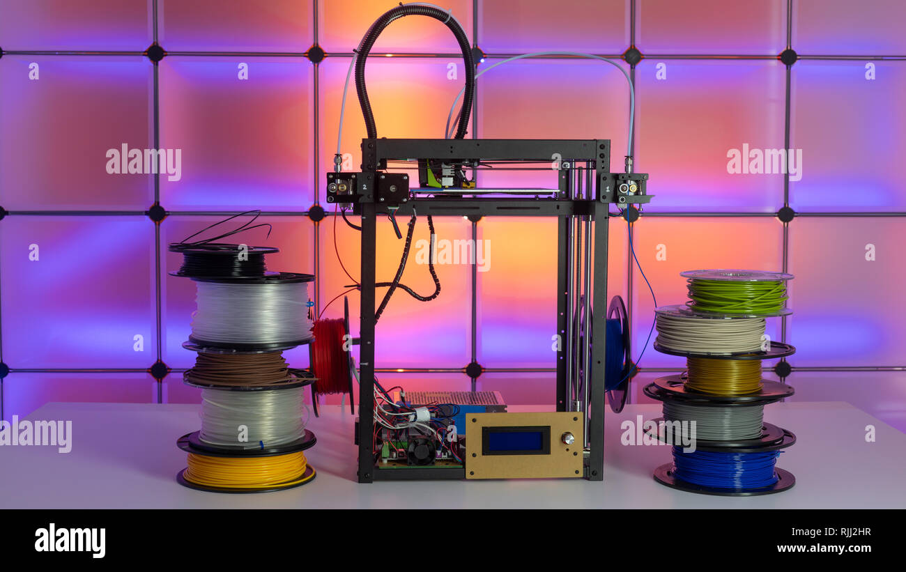 3d printer and plastic filament on color background Stock Photo - Alamy