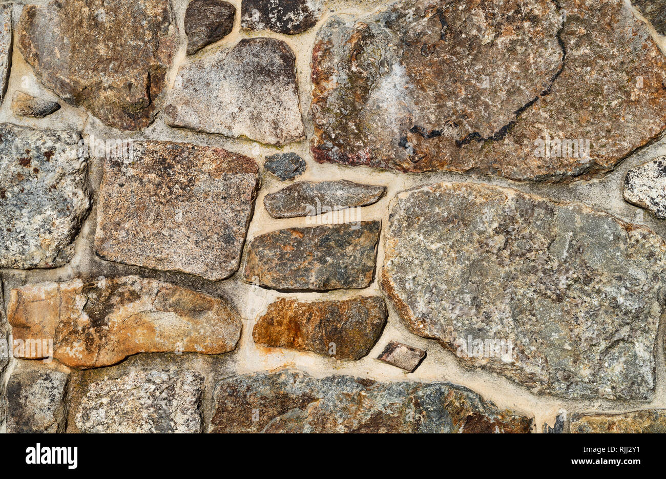 Surface of a very old stone wall in the early morning light Stock Photo ...