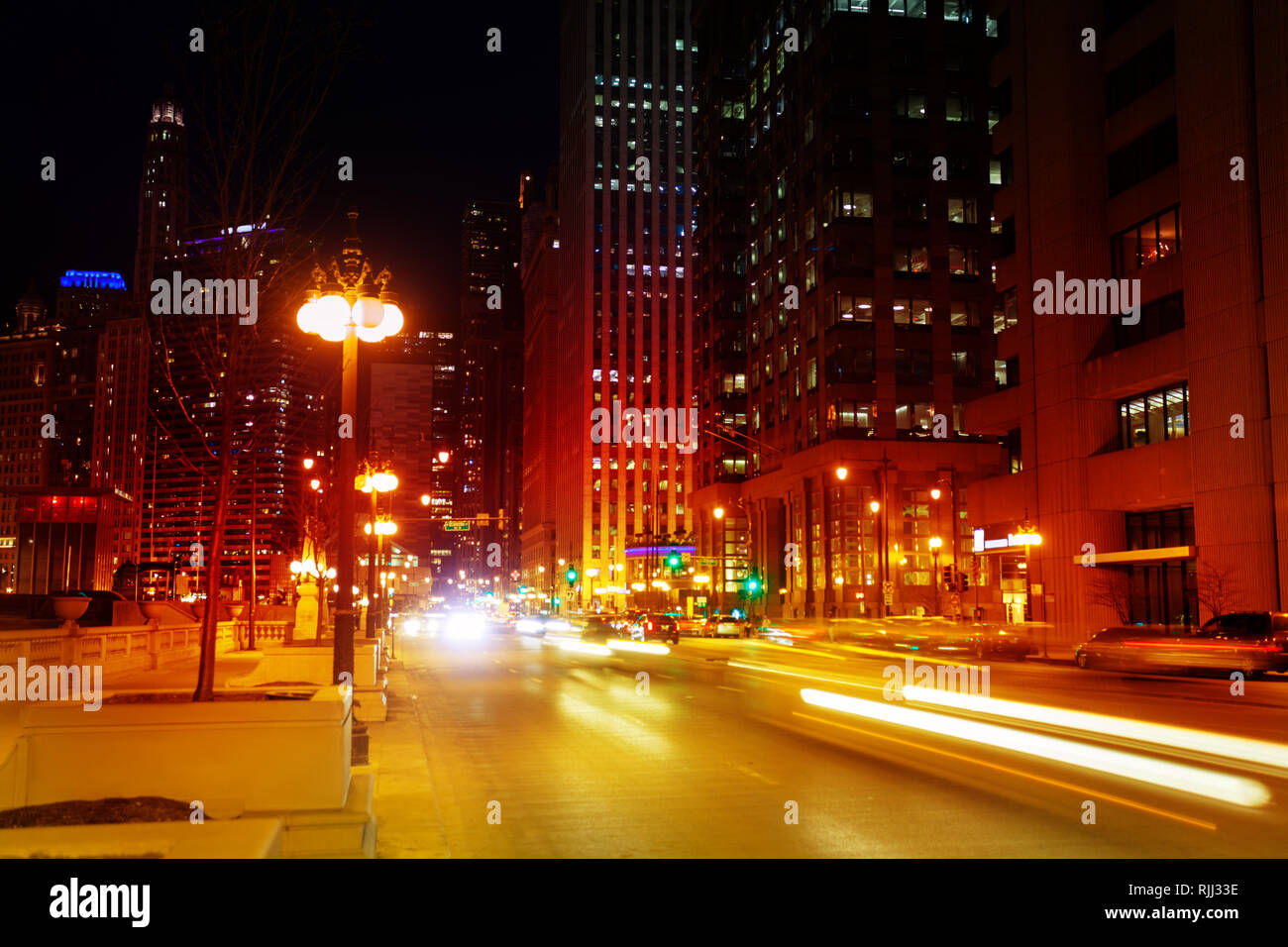 Busy traffic on Chicago road with blurred cars light trails in night ...
