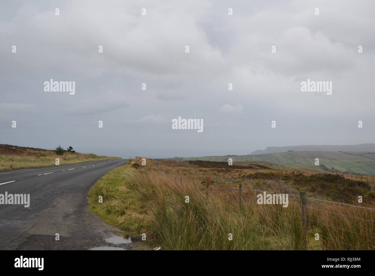 road running through rural Belfast, Ireland landscape Stock Photo - Alamy