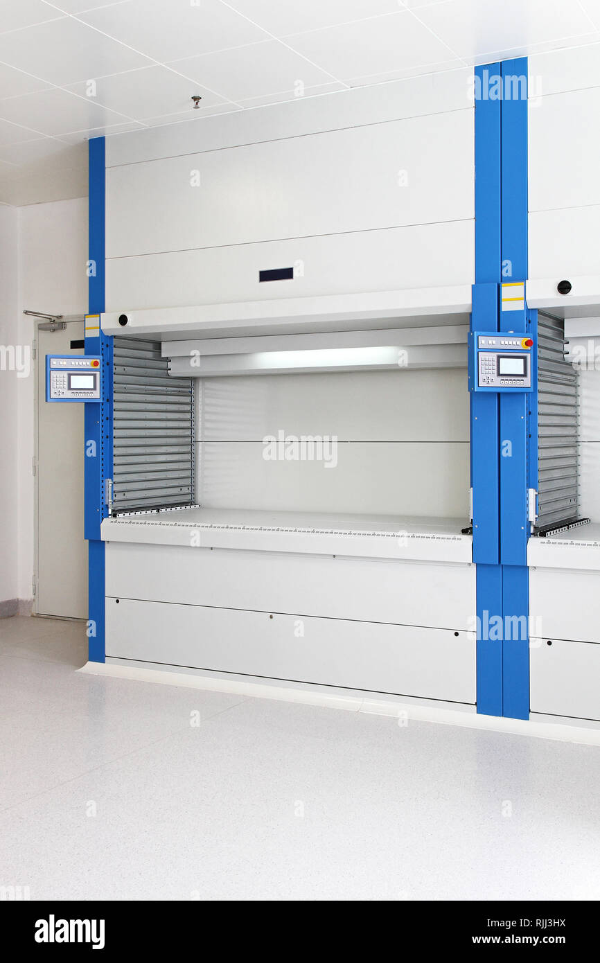 Vertical carousel for storage in modern warehouse Stock Photo - Alamy