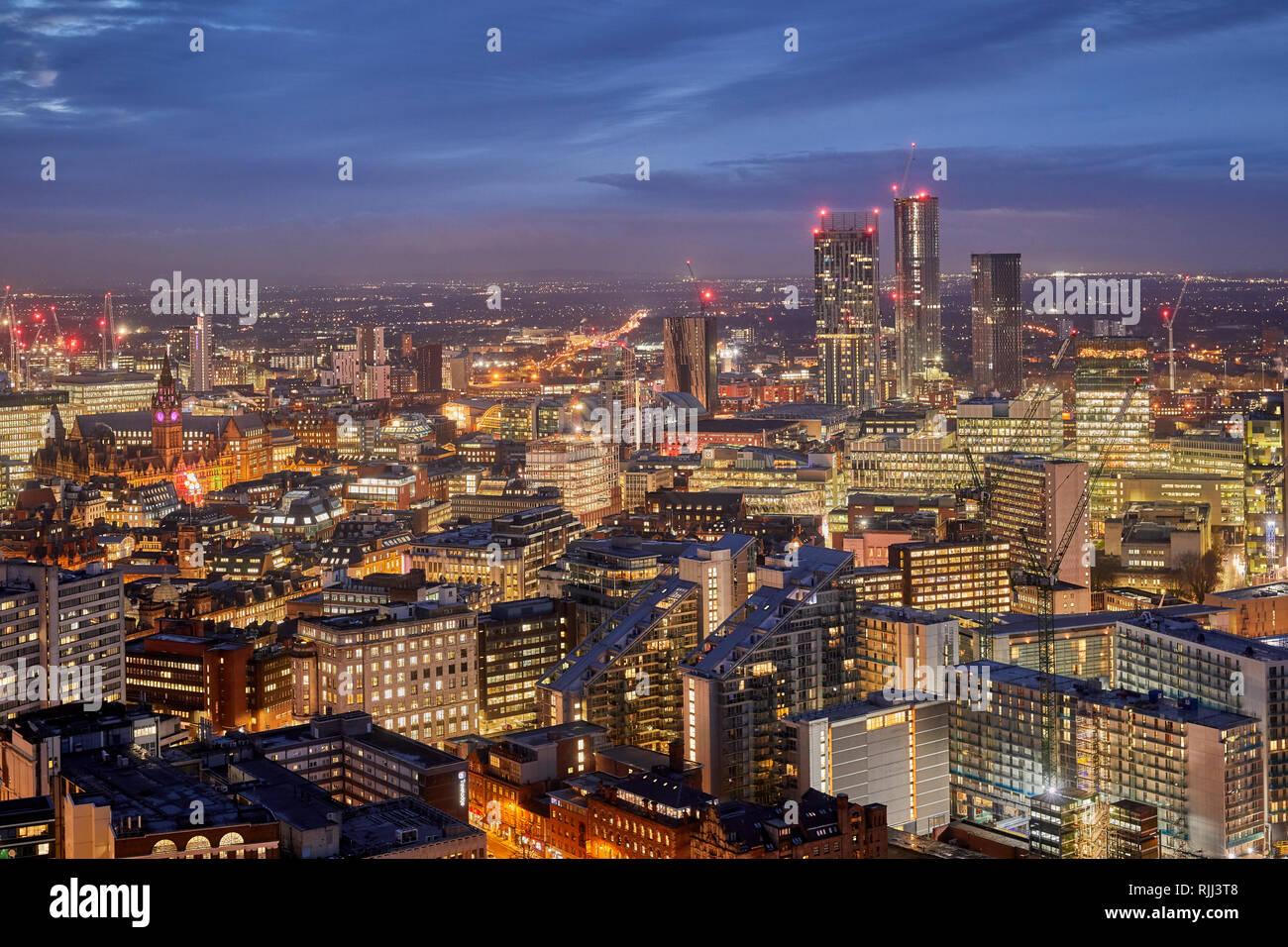 Manchester city centre skyline view across the rooftops from Salford ...