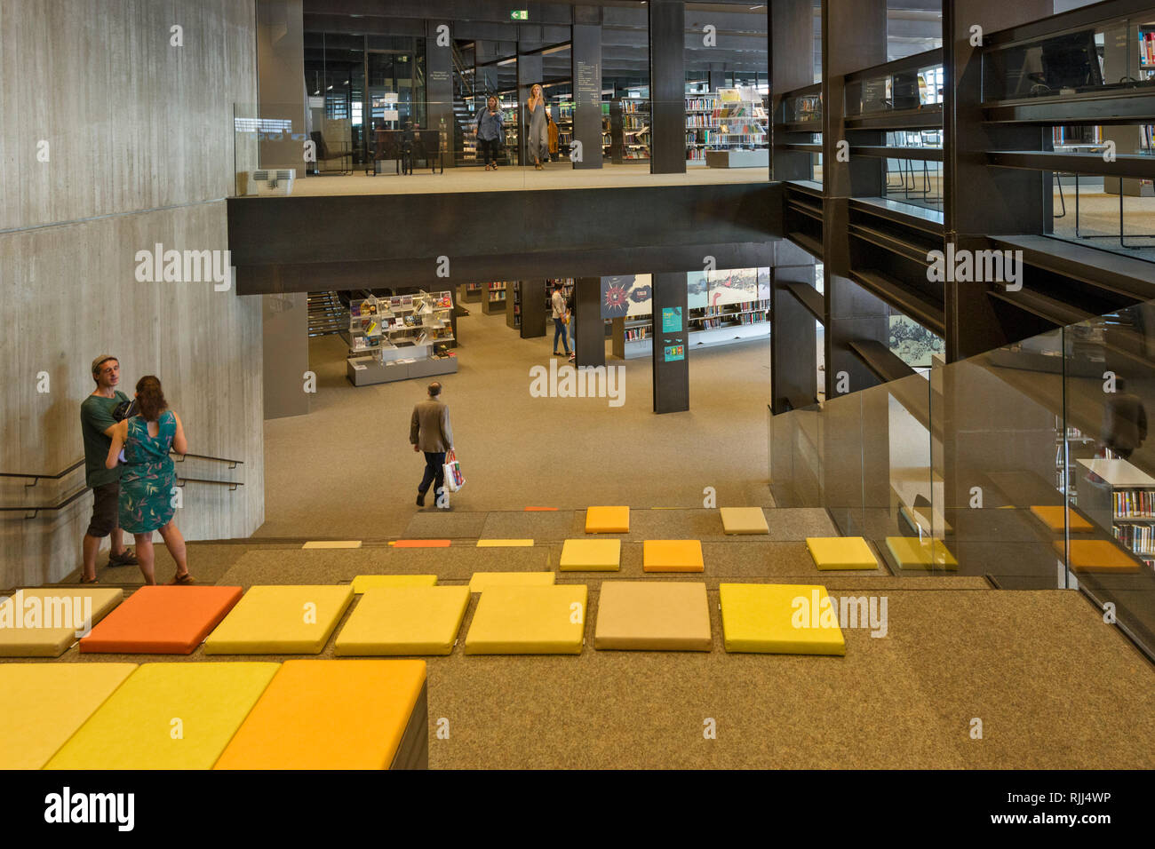inside the new public library De Krook with bookshelves and lounge in ...