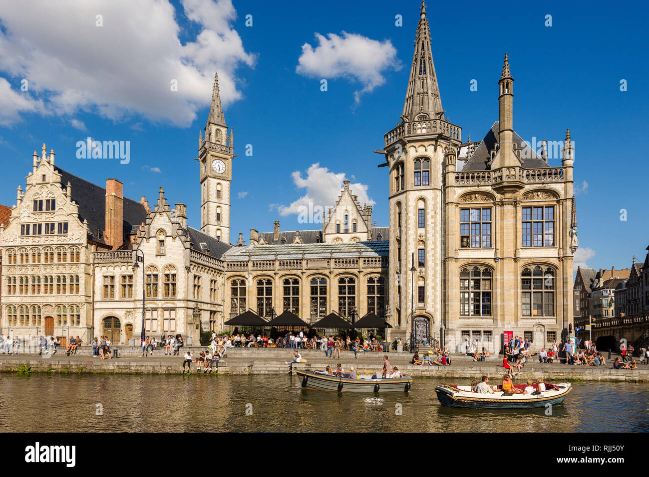 View of the Graslei, old Post Office and Clock Tower over Leie river in ...