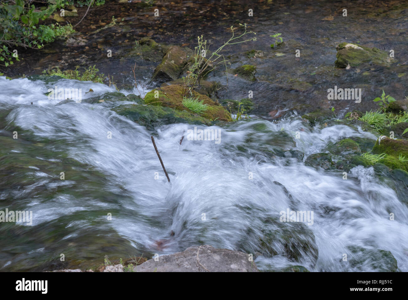 A top down view of a small waterfall. The photographer slowed the ...