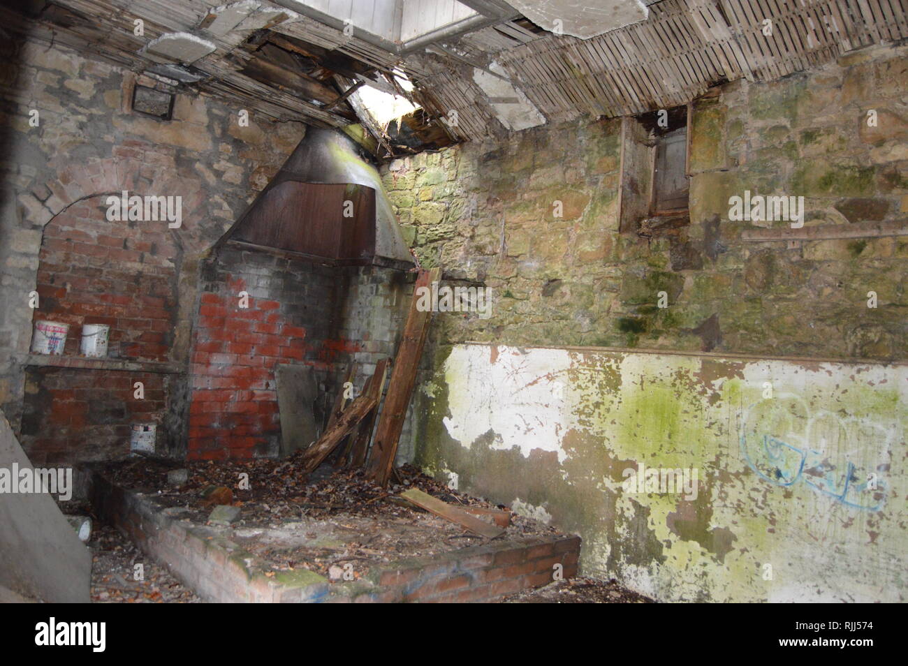 The ruined interior of a building at the entrance to the striking ruins ...