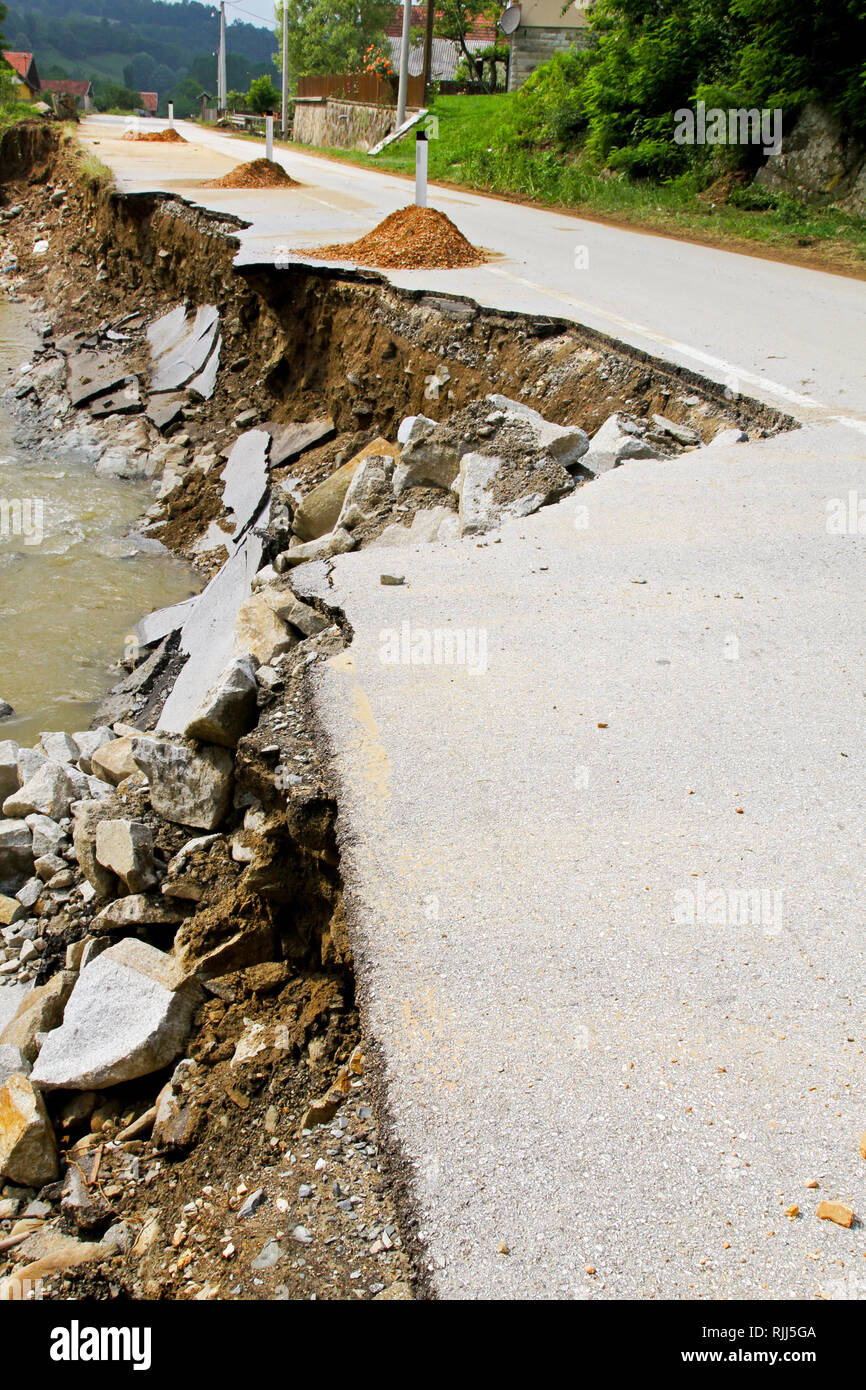 Destroyed road landslide damaged in powerful flood Stock Photo - Alamy