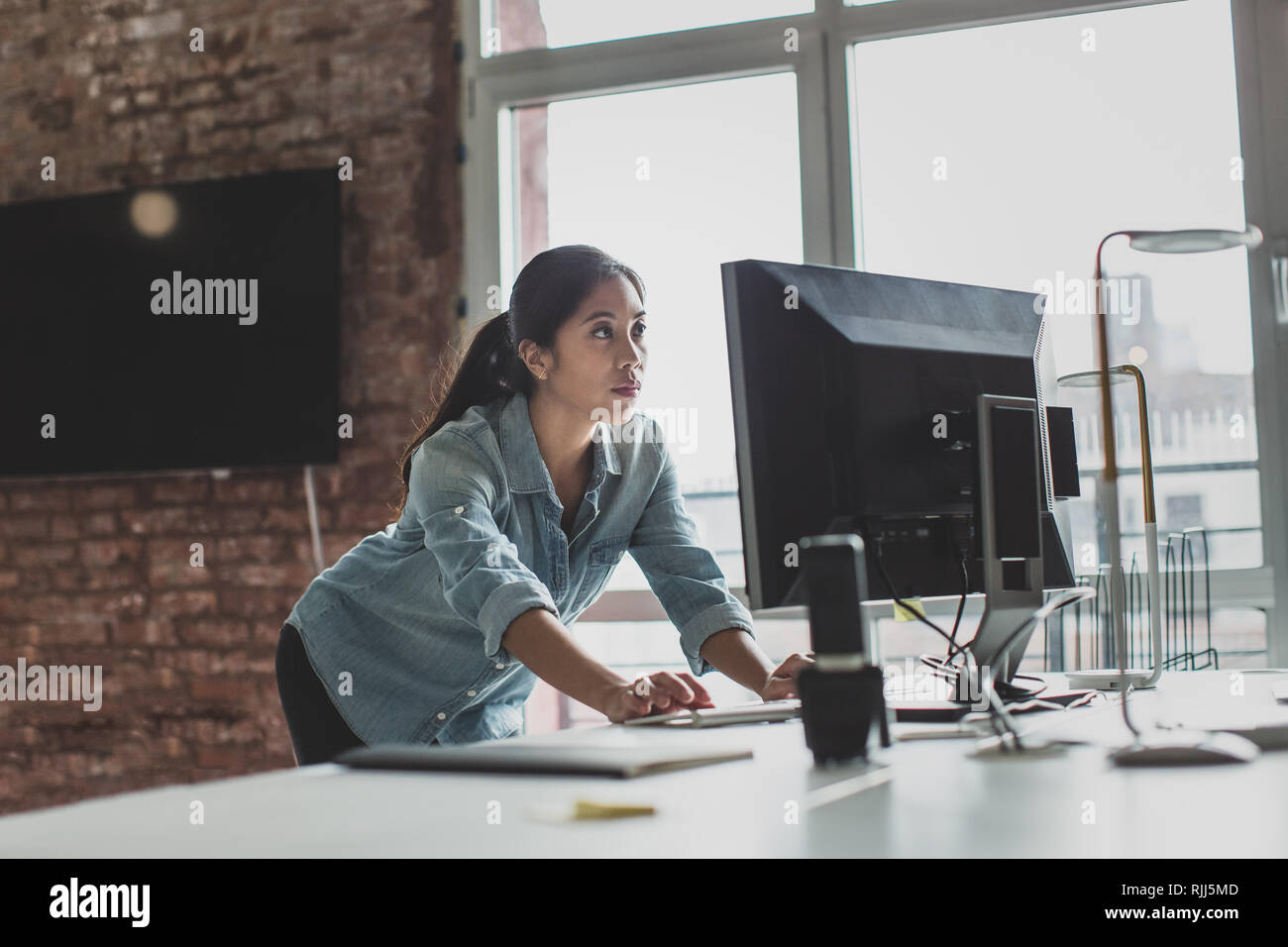 Young asian woman coding desktop hi-res stock photography and images ...