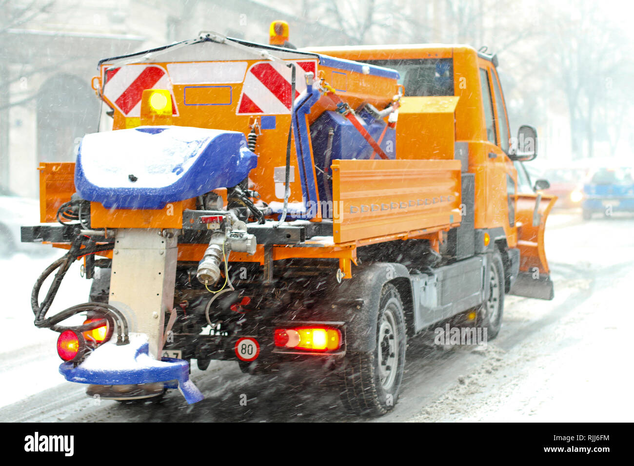 Snow plough truck with salt and grit spreader Stock Photo - Alamy