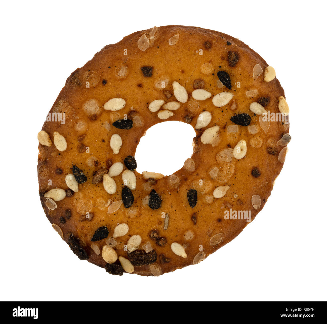 Top view of a single bite size bagel chip with assorted seeds isolated ...