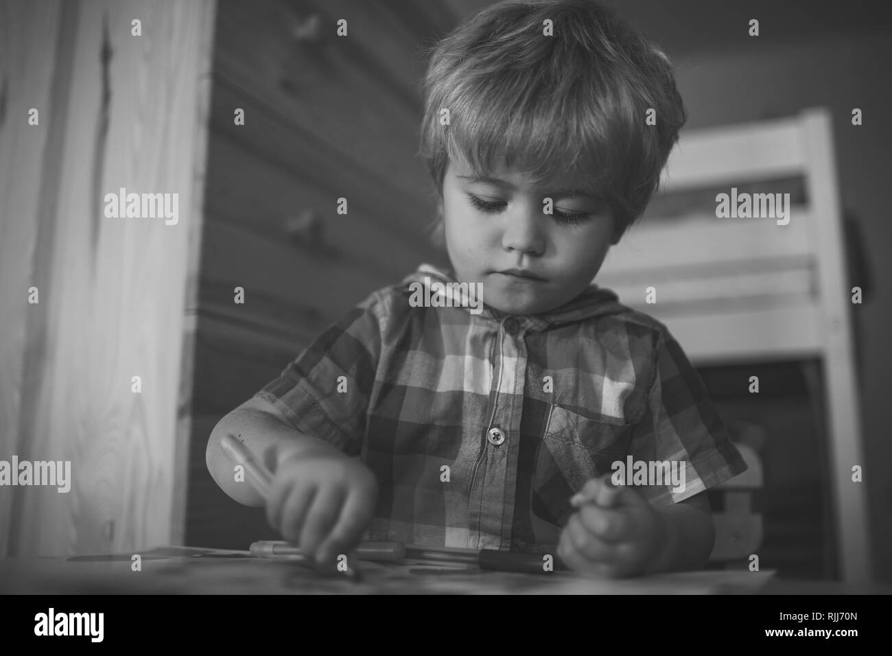Boy coloring markers Black and White Stock Photos & Images - Alamy