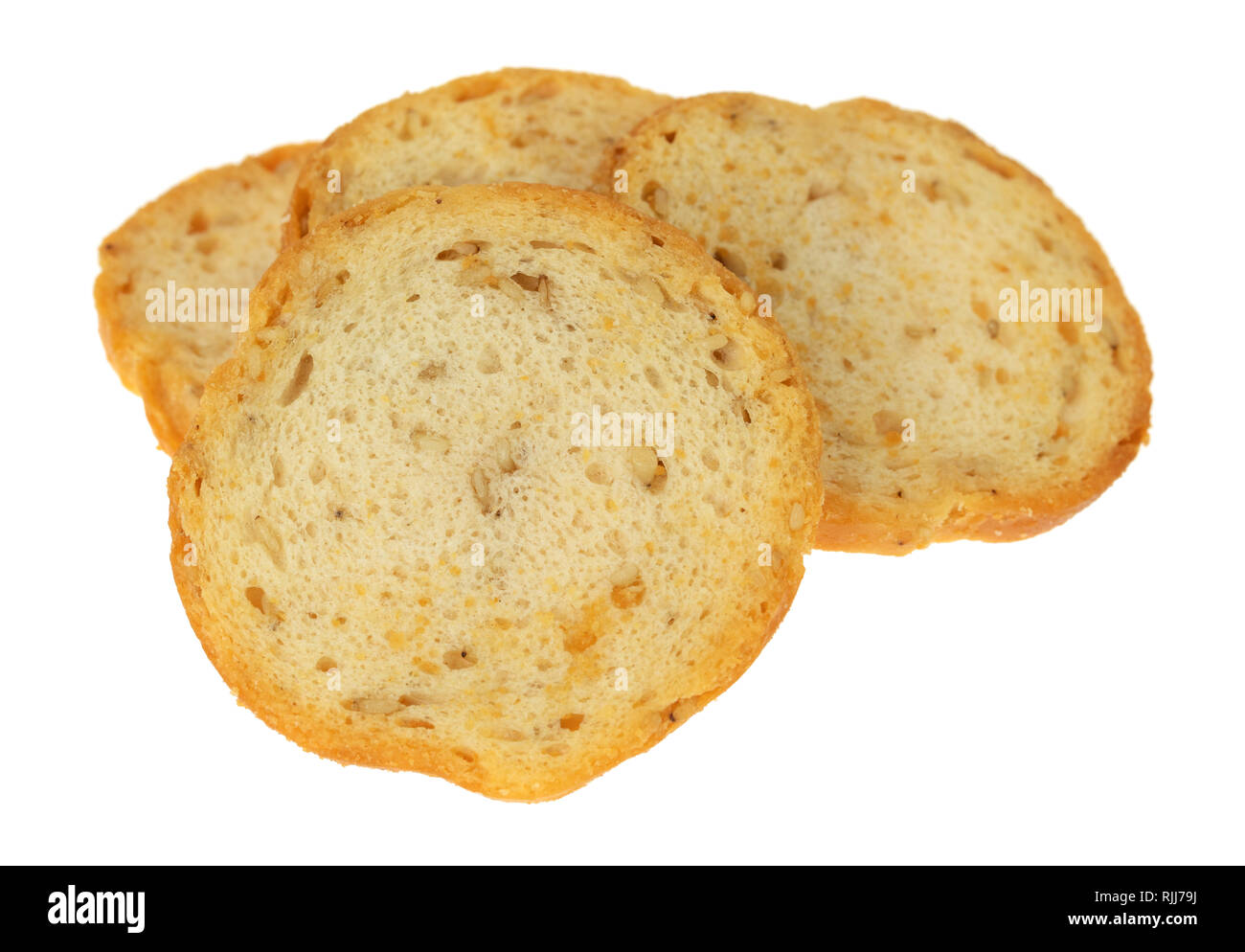 Four pieces of sesame round melba toast isolated on a white background ...