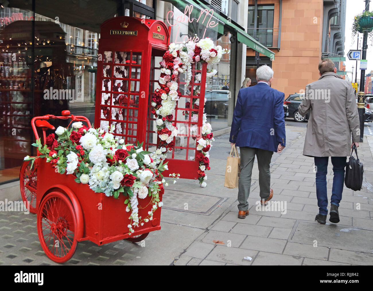 Valentines Day 'Call me Love' display of roses around a telephone box ...