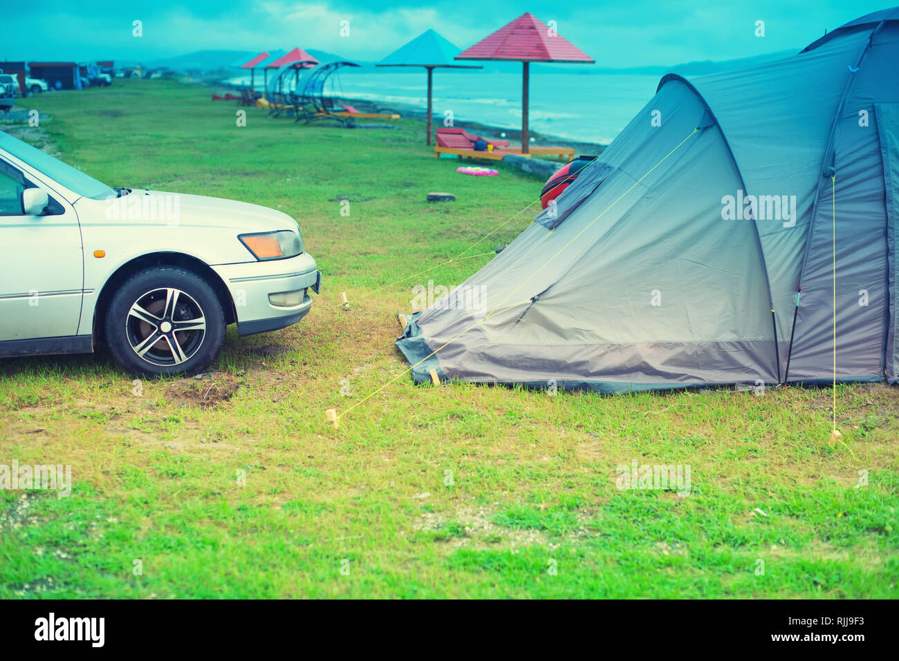 Seascape summer travel machine tent rubber boat. Coastline horizon sky ...