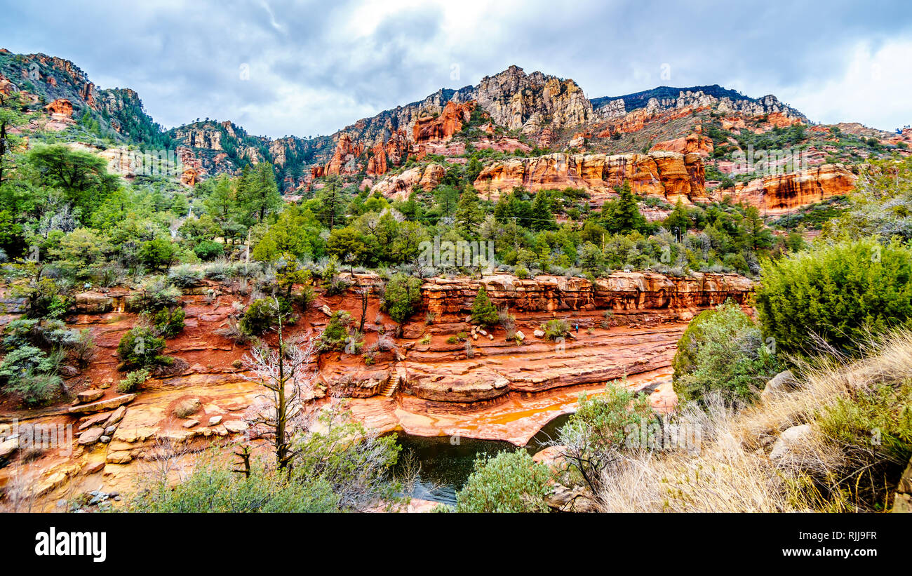 The colorful sandstone mountains and canyon carved by Oak Creek at ...