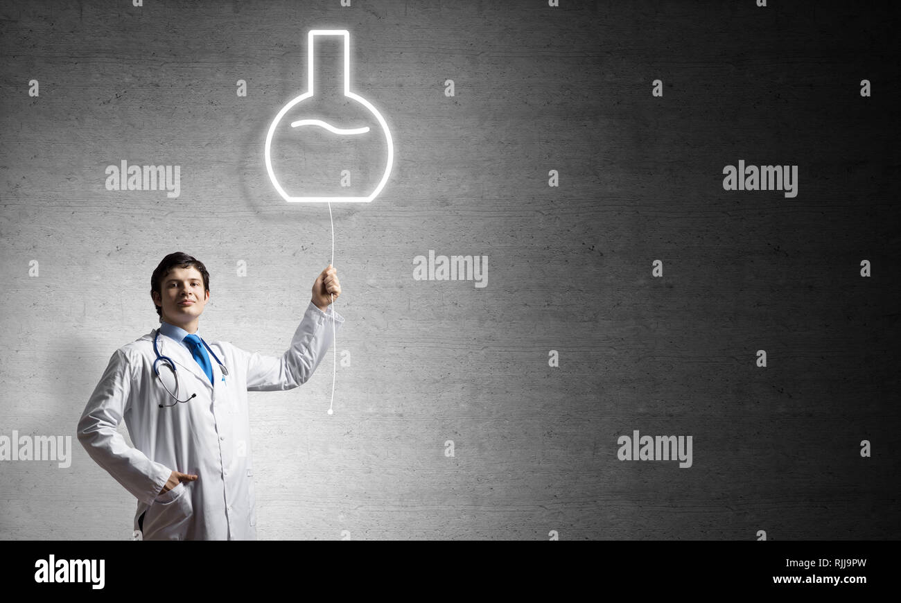 Doctor and vial symbol Stock Photo - Alamy