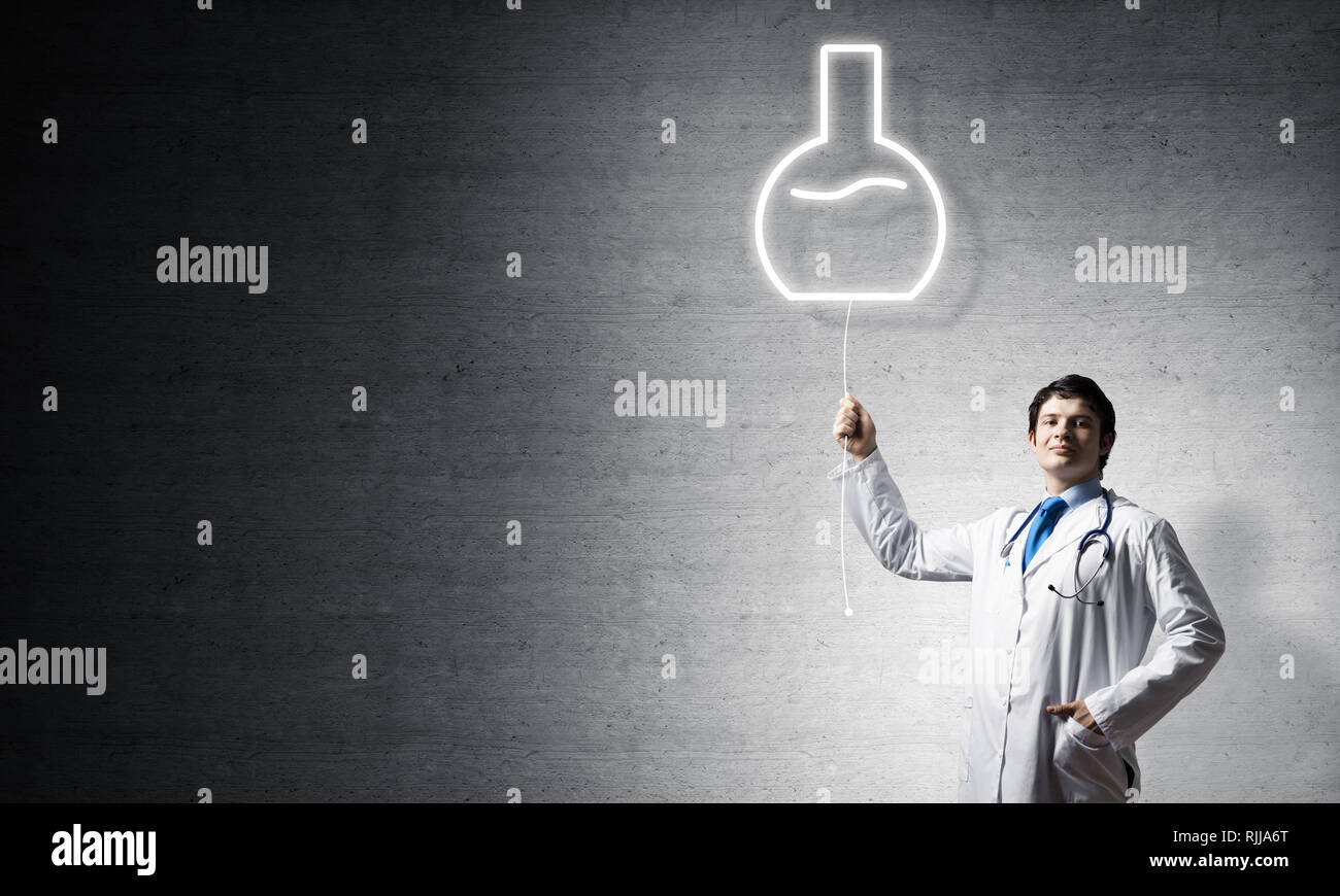Doctor and vial symbol Stock Photo - Alamy