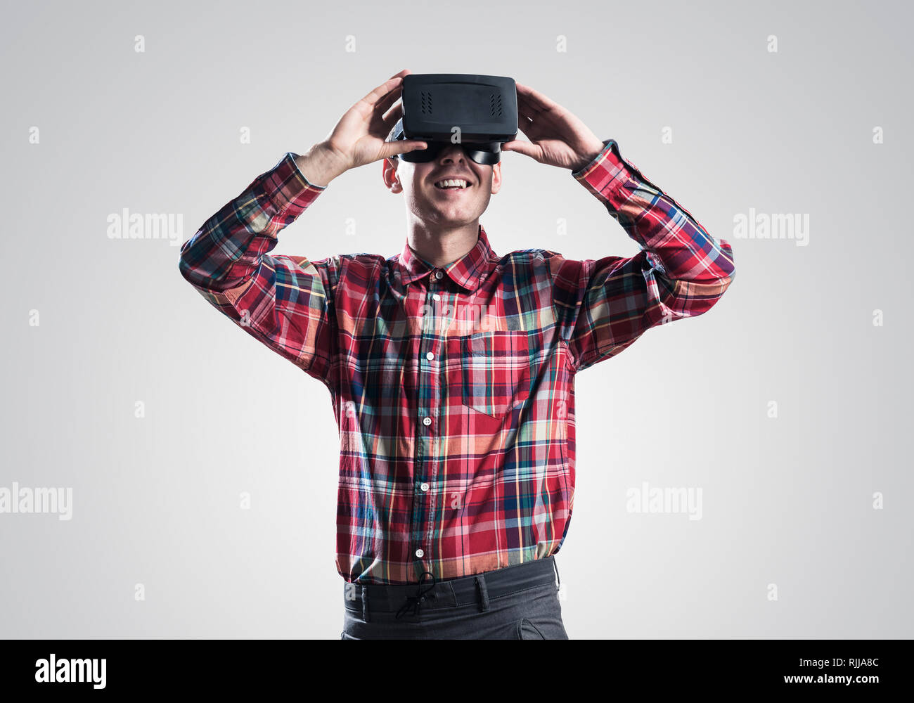 Guy in mask experiencing virtual reality as new entertainment device ...