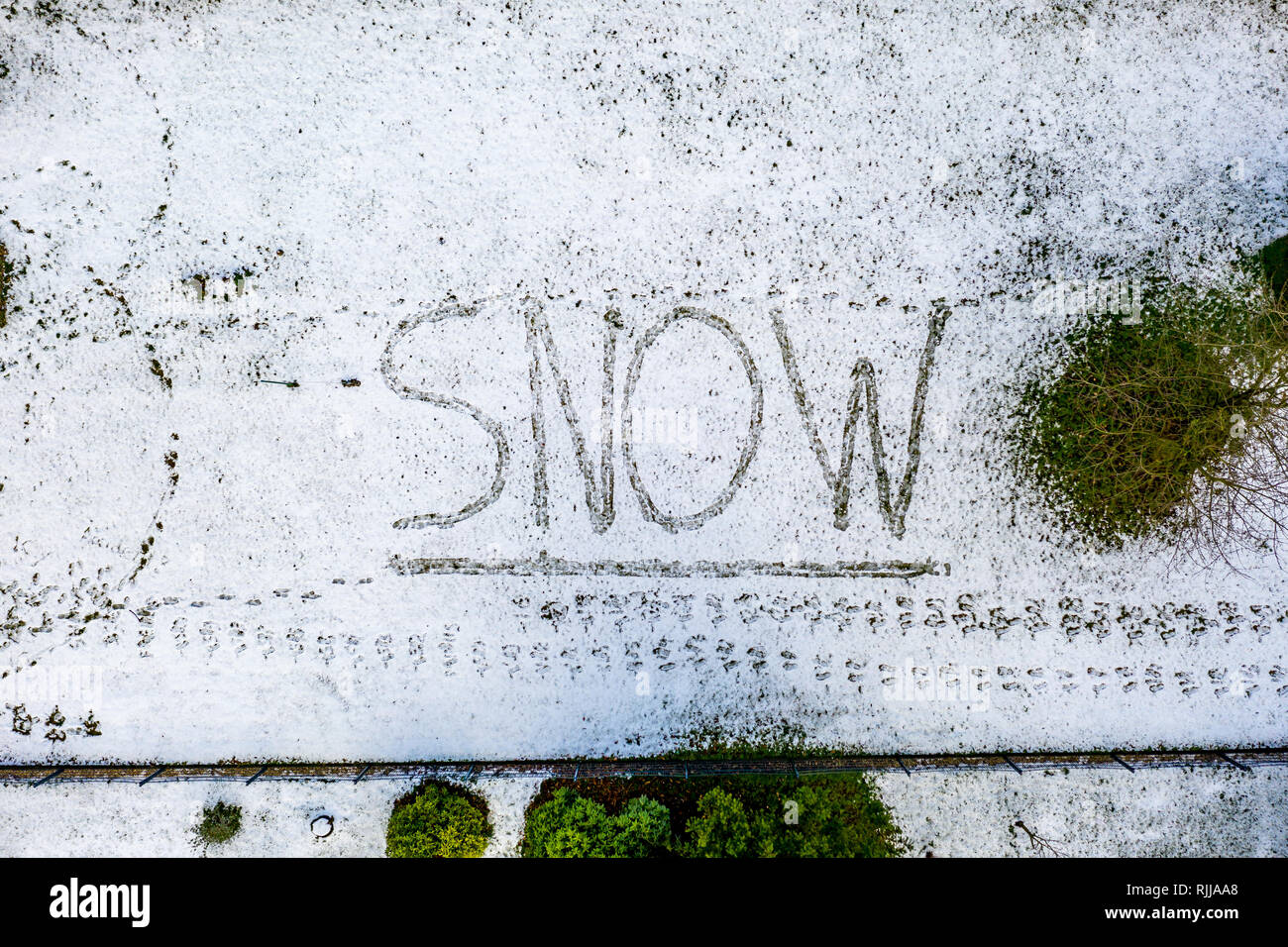 Flying above the word snow written in snow Stock Photo - Alamy