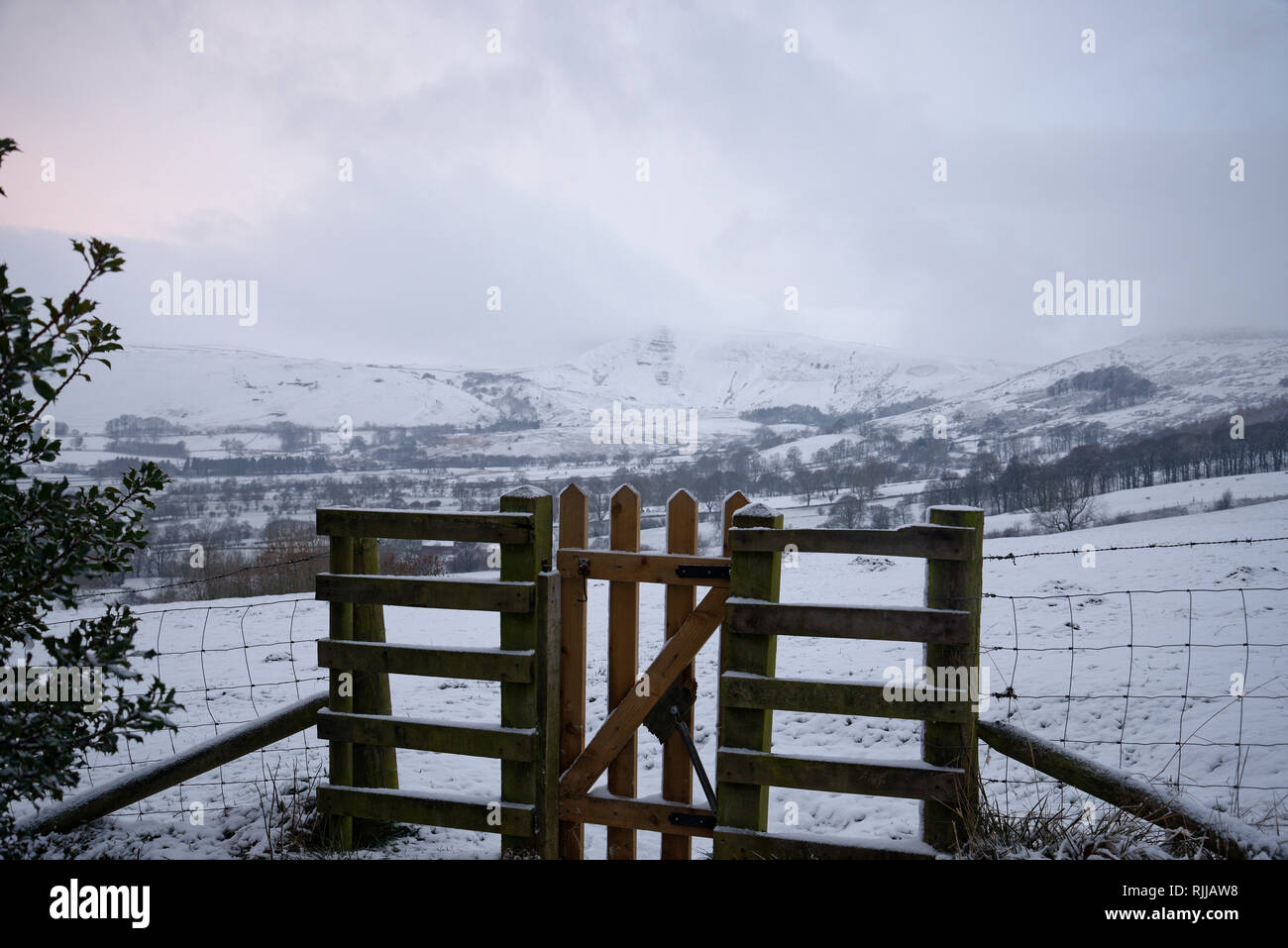 Snowy dawn in the Peak District National Park, England. Twilight light ...