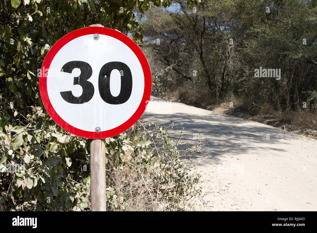30KM sign road signal on a dirtroad in Botswana Stock Photo - Alamy