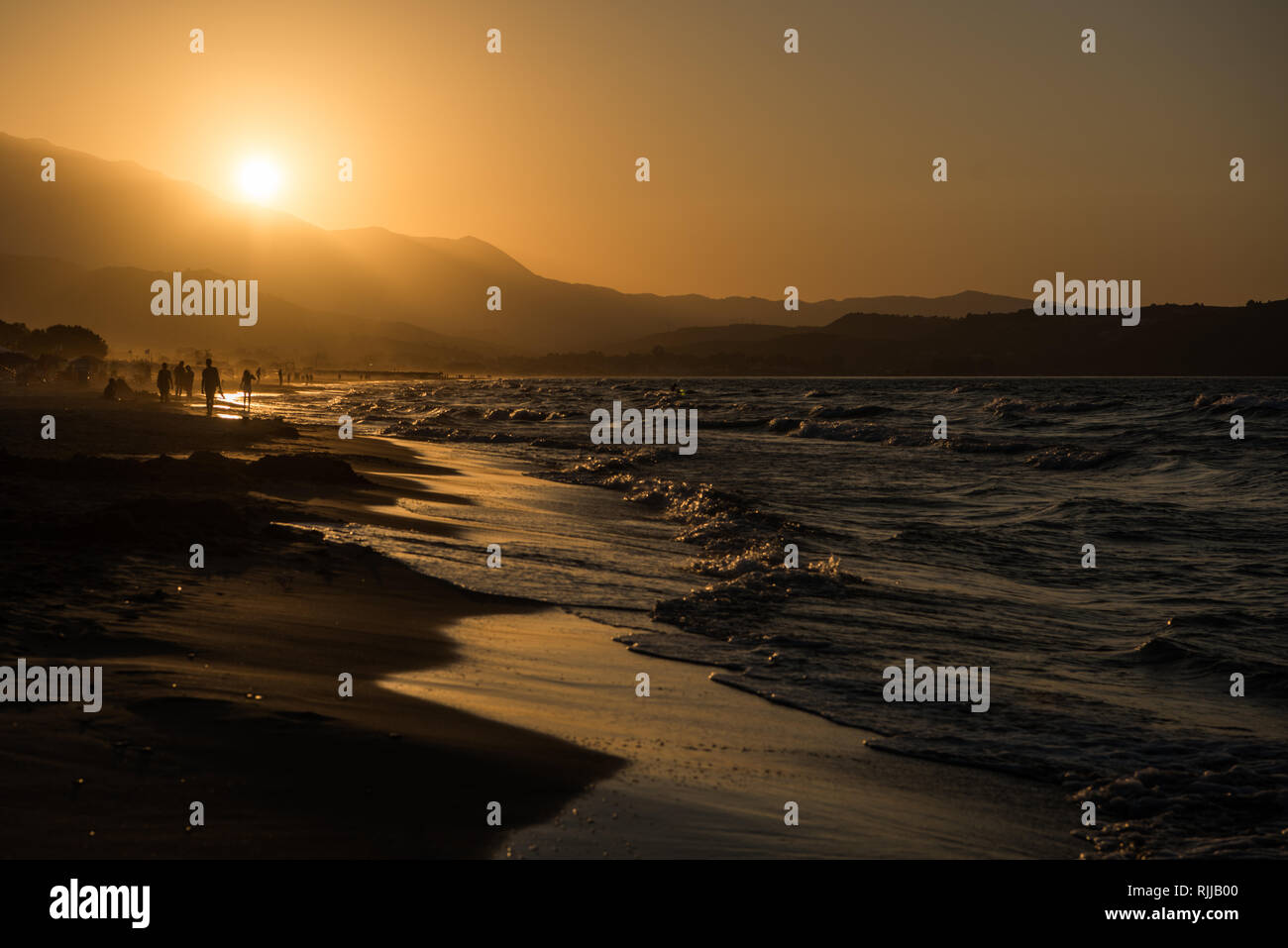 Sea and beach at sunset Stock Photo - Alamy