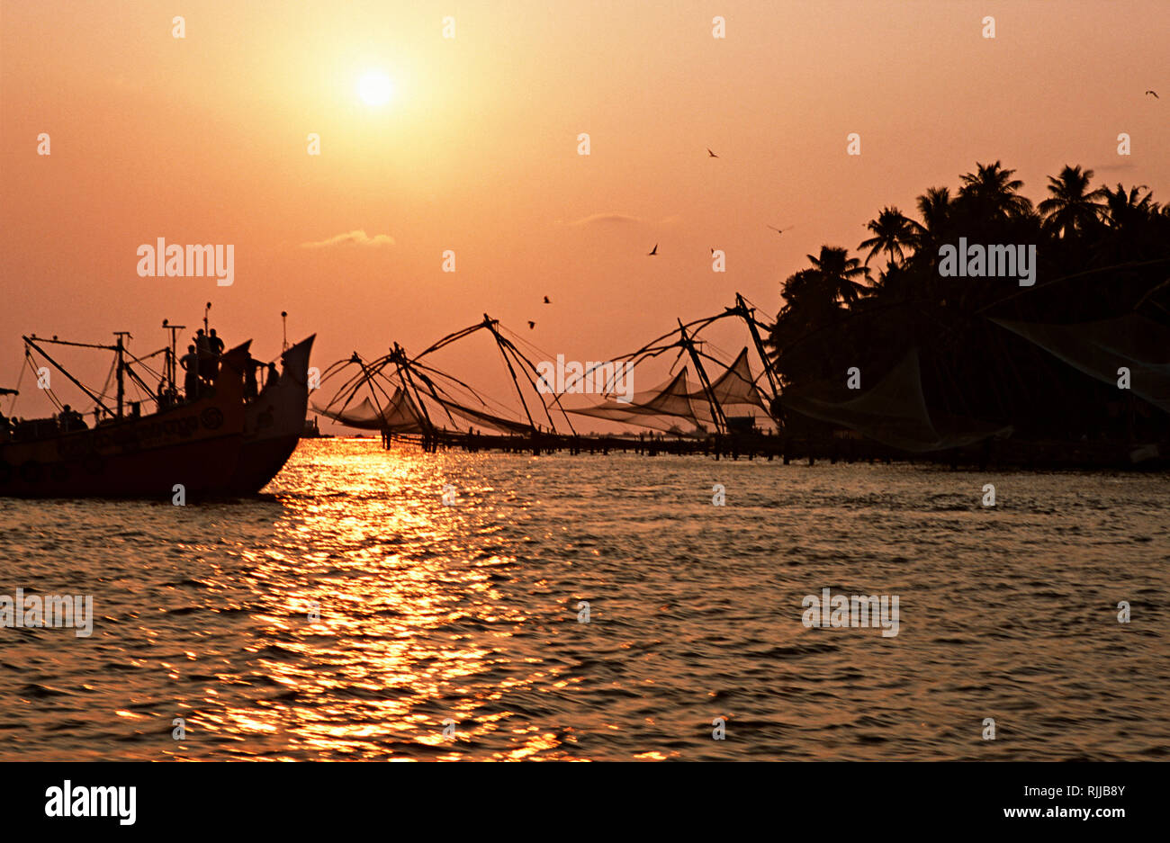 Chinese fishing nets line the mouth of the harbour at Fort Cochin, an ...