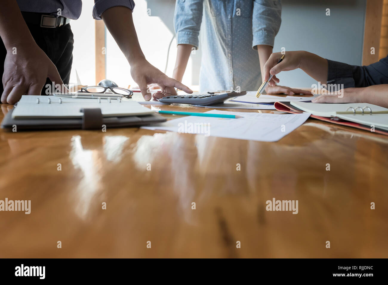 Business team meeting and discussing project plan. Businessmen ...