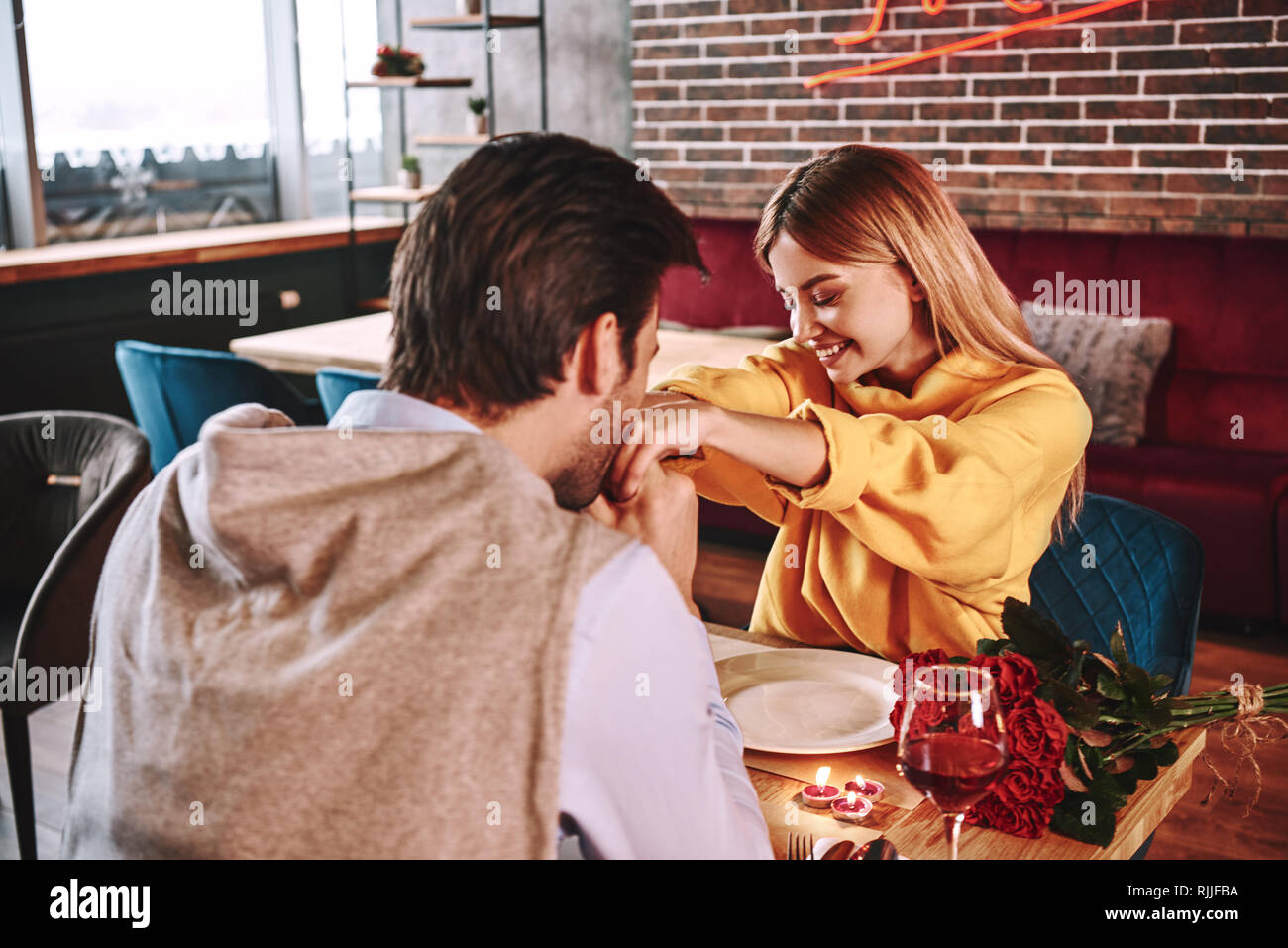 Man kisses girl dinner table hi-res stock photography and images - Alamy