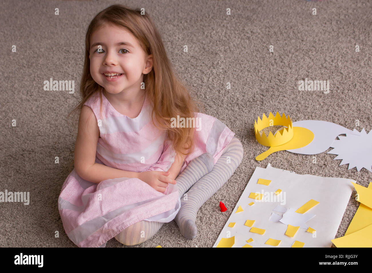 Cute little 4 years old girl making crafted applied ornament with ...